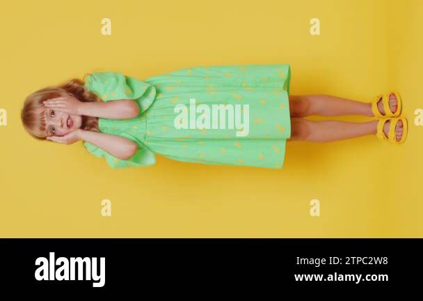 Scared fearful young blonde child girl kid terrified about danger ...