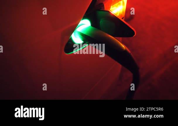 Electric car charging at night time. Power connector inserted into EV ...