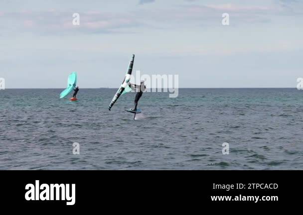 Modern water sport. Hydrofoil ride on the ocean using the wing and the ...
