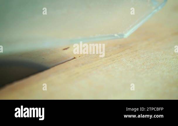 Cutting wood at a wood factory. Close up clips of sawing wood. A ...