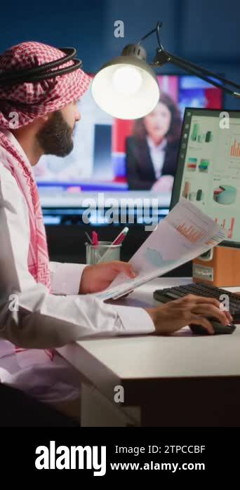 Vertical video Arabic teleworker checking analytics statistical data ...