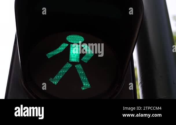 Close-up of traffic light at intersection of large city,regulating ...