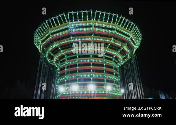 Carousel with lights. Theme park. Popular swing rides. Colorful ...