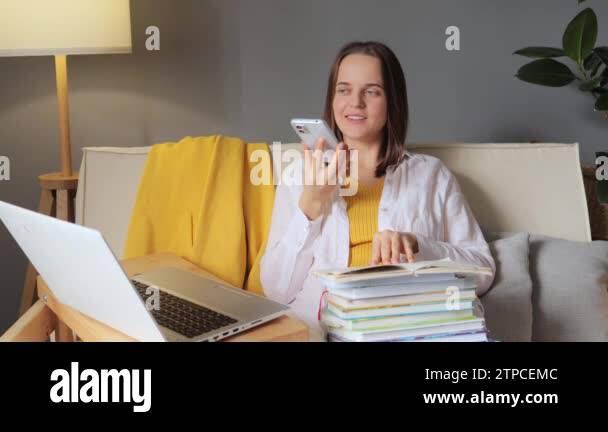 Student woman recording voice message making phone call on speaker ...