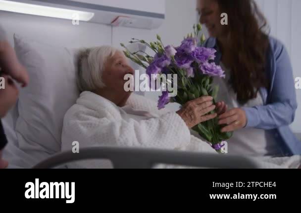 Loving family with little child visits grandmother recovering after ...