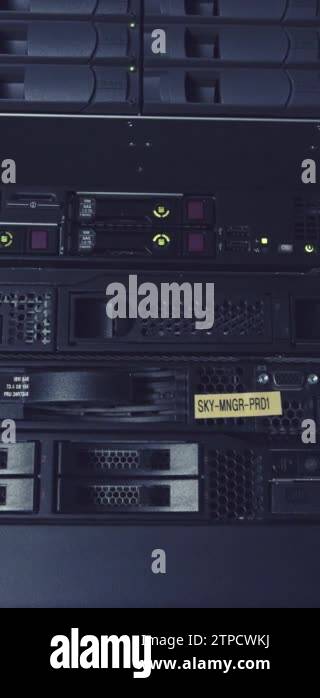 Vertical video of a large computer server room in a data center with blinking lights Stock Video ...