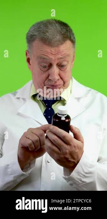 Senior doctor reads instructions medicines and does not recommends to ...