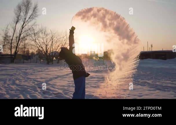 Converting hot water into steam, extreme cold -30 -35 degrees. The man ...
