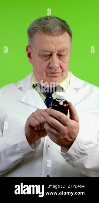 Senior doctor reads instructions for medicines and recommends to ...