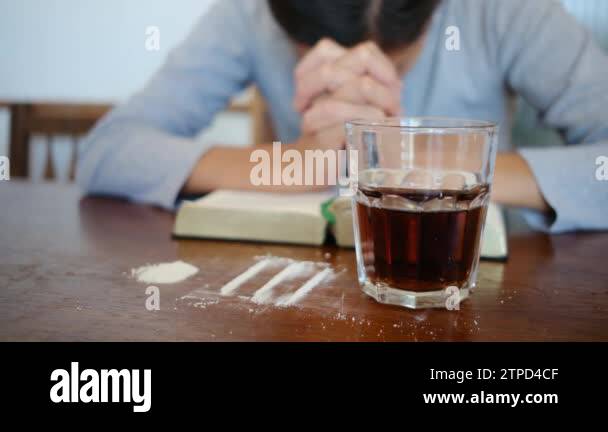 A woman, seeking detox and salvation from drugs and alcohol, fervently ...