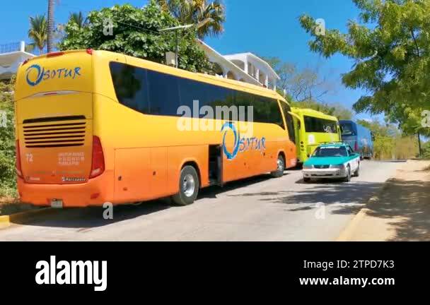 Puerto Escondido Oaxaca Mexico 25. March 2023 Various colorful buses ...