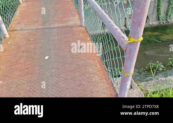 bridge crossing the outdoor concrete drainage system at the city street ...