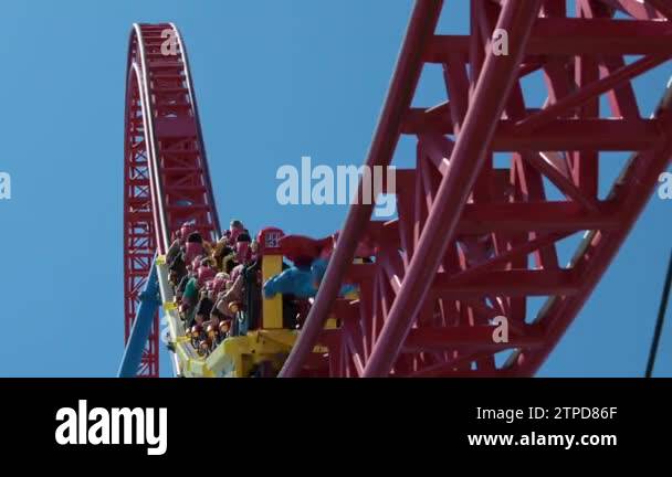 GOLD COAST, AUS - OCT 10 2023:Group of tourists ride on Superman Escape ...