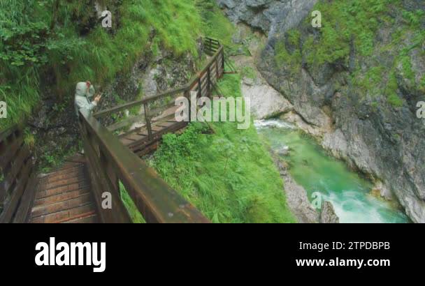 Woman tourist taking photo and video using phone camera during autumn ...