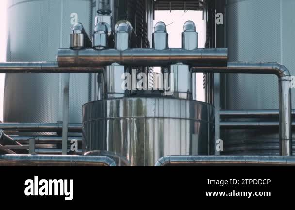 Stainless steel pipes and storage tanks. Industrial wine production ...