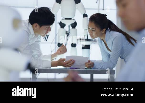 4K Technical design team working on construction of robot in modern lab ...