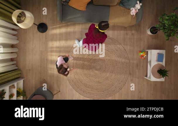 In The Shot From Above A Mother And Her Daughter Are Standing In The