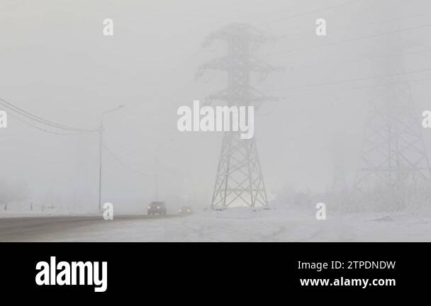 High-voltage power lines in the frost on a cold day in winter Stock ...