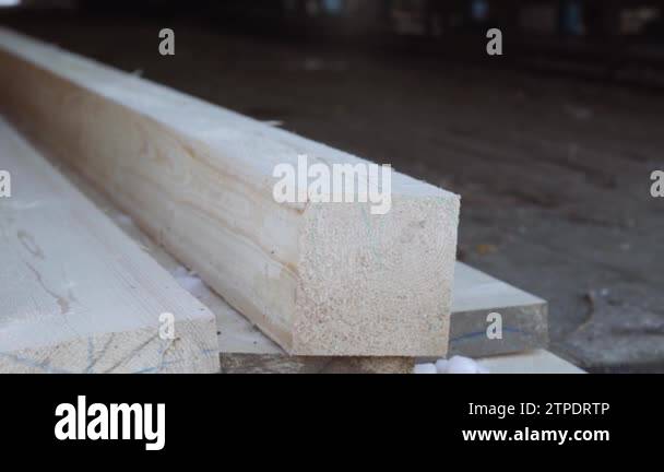 Lumber bar on planks stack at sawmill storage Stock Video Footage - Alamy