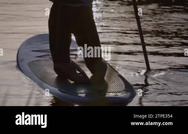 Sap board with a silhouette of a young man, rear view. An athlete is ...