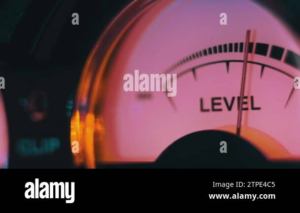 Analog round arrow indicator of audio signal level with yellow ...