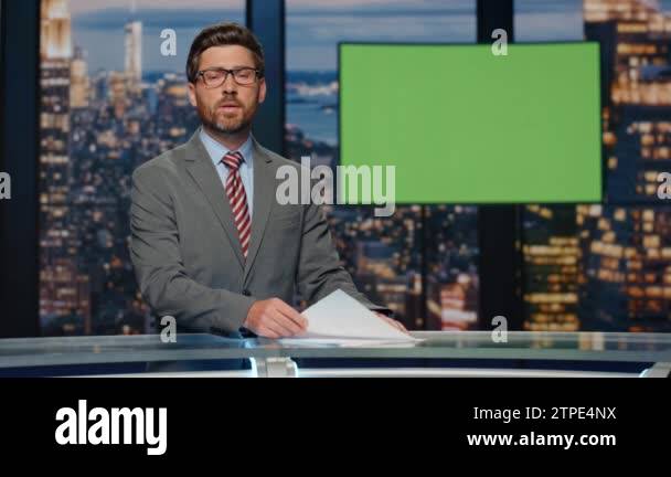 Broadcast presenter reporting daily news at television channel ...
