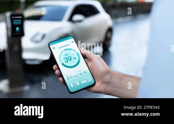 Businessman holding smartphone display battery status interface by ...