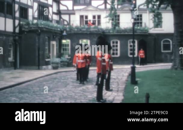 Two Coldstream Guards standing perfectly still in the garden of the ...