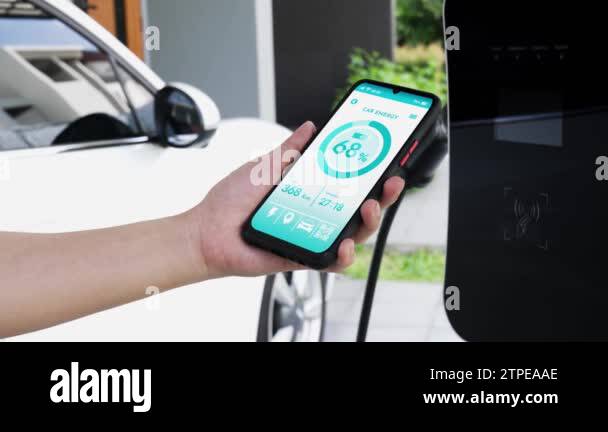 Smartphone display battery status on smart EV mobile application while ...
