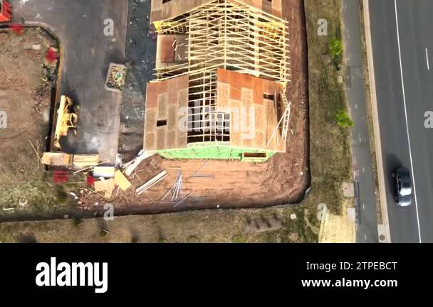 Construction site top view. Construction of a roof on a new three-story ...
