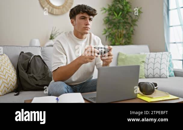Confident young hispanic teenager, an avid gamer, indulging in an epic ...