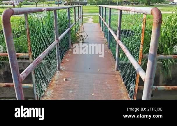 bridge crossing the outdoor concrete drainage system at the city street ...