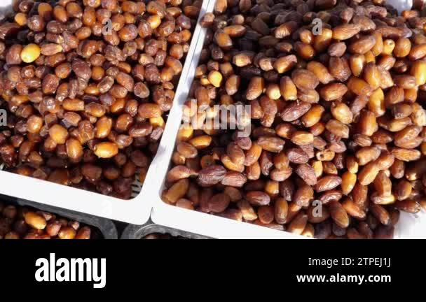 Fresh harvested Moroccan dates. Traditional souk, dates market in ...