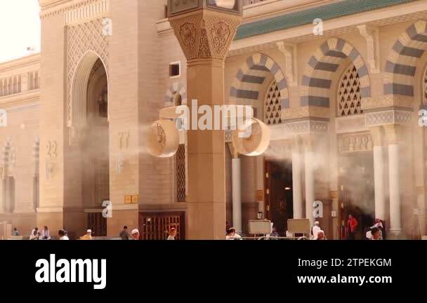 City of Medina in the Kingdom of Saudi Arabia. Fan spray cool water ...