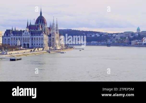 The riverside cityscape with symbols of Budapest - building of ...