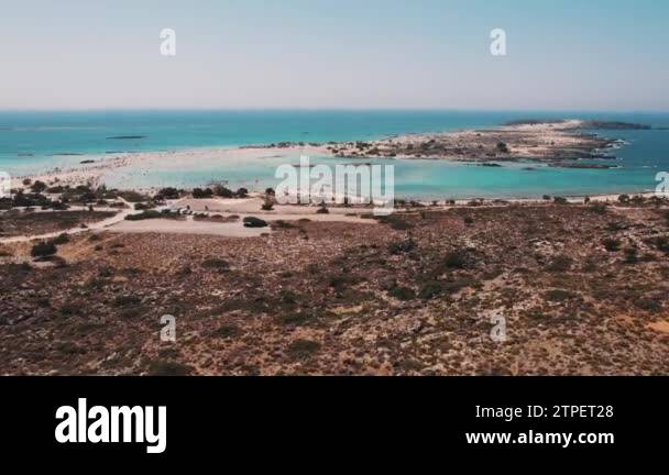 Birds eye perspective over Elafonisi Beach filled with tourists ...