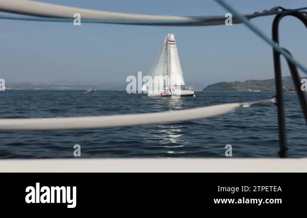 Sailing yacht during the competition. Crew members sitting on board the ...