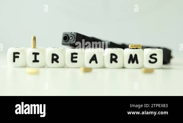 Word firearms and automatic pistol with bullets. Concept of having an ...