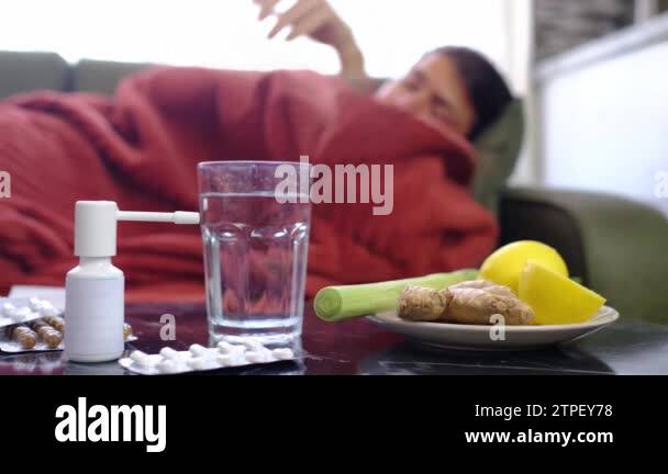 Ginger, lemon, onion and different drugs on table on background sick ...