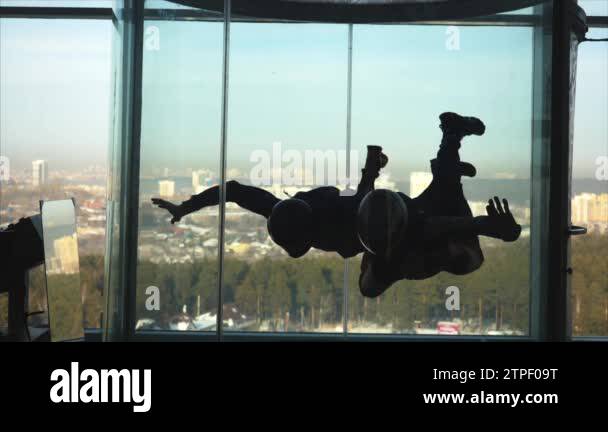 A group of persons trying the Worlds biggest free fall simulator ...