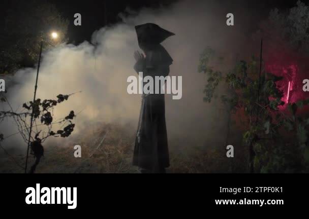 Monk With monster face walk in the night forest for Halloween Stock ...