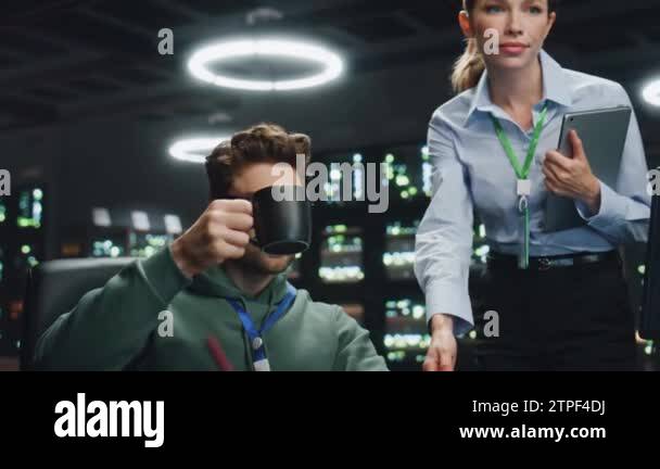 Two specialists working datacenter discussing work issues together ...