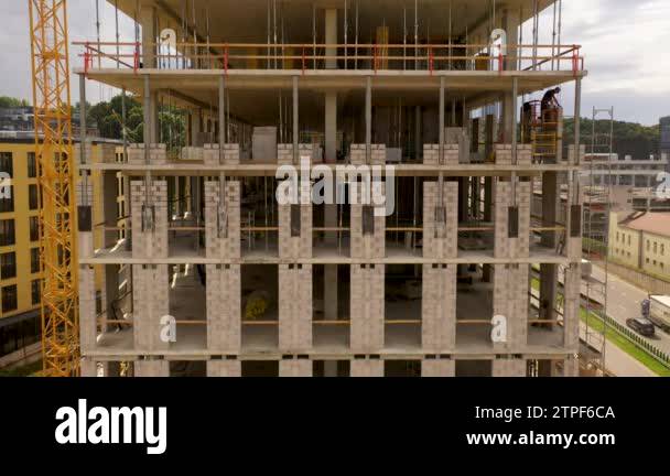 Drone footage of high rise building construction site close up and ...