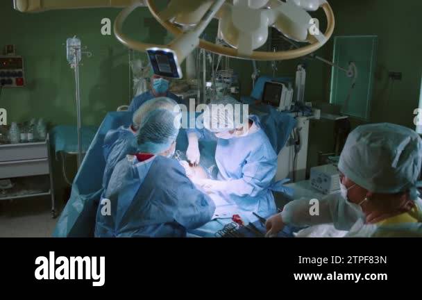 Doctor Performing Surgery Using Sterilized Equipment. Surgical Team ...