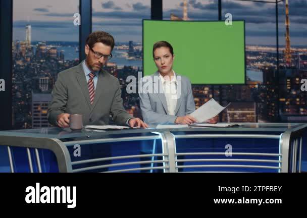 Couple reporters talking chromakey news studio making evening broadcast ...