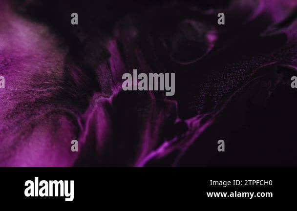 Paint splash. Ink water. Defocused neon purple black color glitter ...
