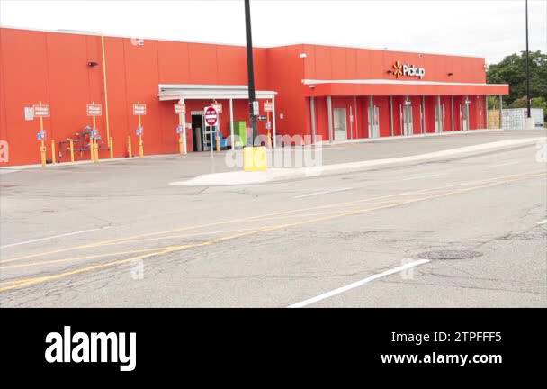 walmart pickup area orange building side of walmart with all empty ...