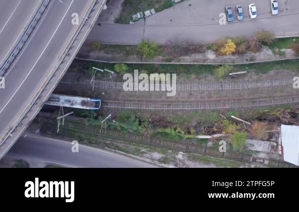 A modern train passes through the city of Almaty. The railway passes ...