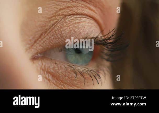 Side view macro close up of light blue female eye opening. Fashion ...