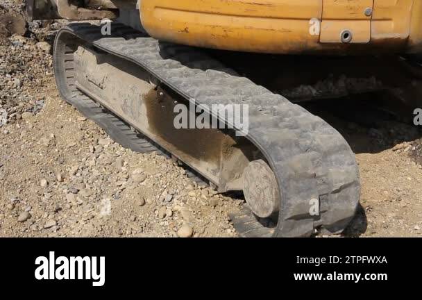 Jackhammer is breaking reinforced pillars to level them.Excavator is ...